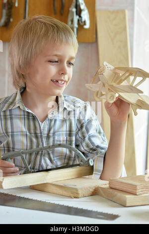 little boy working with plane Stock Photo - Alamy