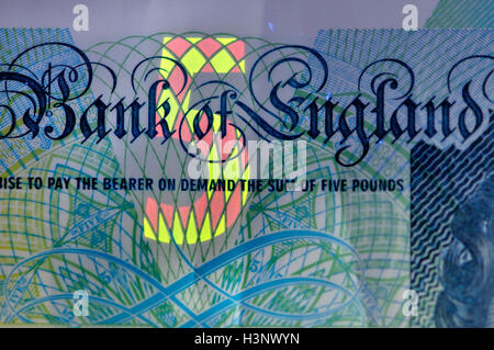 A £20 pound note under ultra violet light showing the security Stock ...