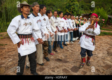 Naxi people in folk costumes dancing tribal dances, Yunnan, China Stock ...