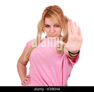 Portrait of a beautiful girl showing stop sign with palms isolated on a ...