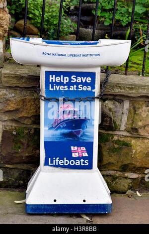 Royal National Lifeboat institution donation box in Robin Hoods Bay in ...