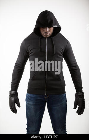 Male spy in gloves on dark background Stock Photo - Alamy