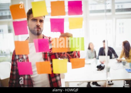 Multi-colored sticky notes on purple background. Memo Day May 21 text ...