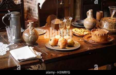 Elizabethan dining table set with typical foods, at Blakesley Hall is a ...