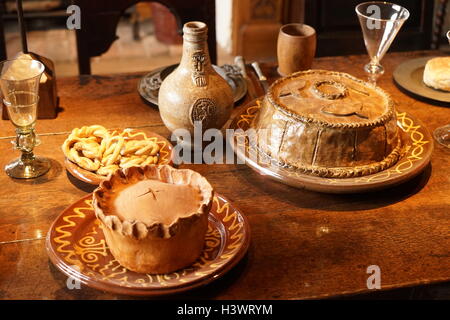 Elizabethan dining table set with typical foods, at Blakesley Hall is a ...