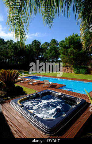 Outdoor jacuzzi and luxurious spa bath and infinity pool along Atlantic ...