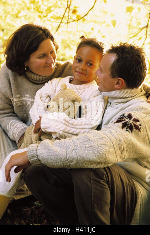 Happy adoptive family of adopted daughter child and woman mother smile ...