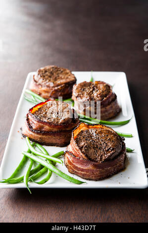 Bacon wrapped filet mignon steak on outdoor camping propane grill Stock ...