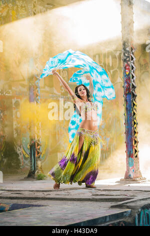 Caucasian belly dancer holding scarf on beach Stock Photo - Alamy