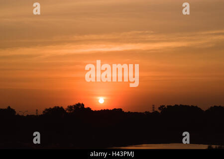 sunset sky with the sun behind the scence Stock Photo - Alamy