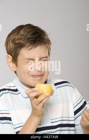 Teenagers, boy, lemon, facial play, acidly, portrait, side view, people ...