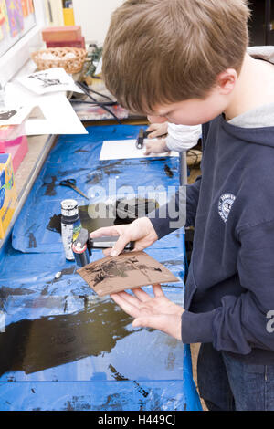 Classroom, art lessons, boy, linocut, looking, back view, cropped Stock ...