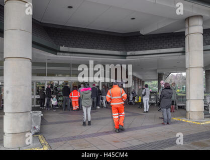 Customers wait outside Morrisons, Corby, during a fire drill practice ...