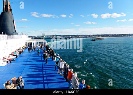Passengers on the outside upper deck of the Norrona ferry boat on the ...