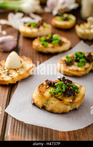 Mini toasts with garlic and dried tomato, sprinkled with herbs Stock ...