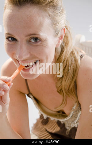 Woman, young, smile, vegetable ticks, eat, portrait, curled Stock Photo ...