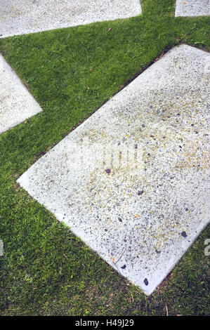 Detail of garden path with stone slabs with gravel, succulents and ...