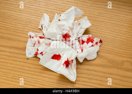 bloody tissue on a wood table Stock Photo - Alamy