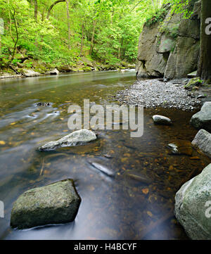 The River Bode with rapids and boulders in the Bode Valley between ...
