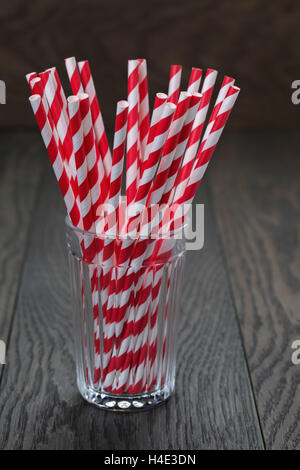 vintage paper straws in glass on wood table, rustic style Stock Photo ...