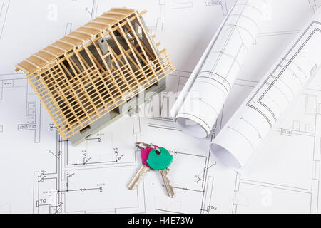 Home keys, small house under construction, electrical diagrams with ...