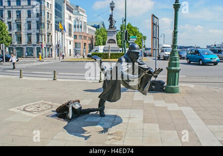 Tom Frantzen’s sculpture depicts a policeman about to fall head over ...