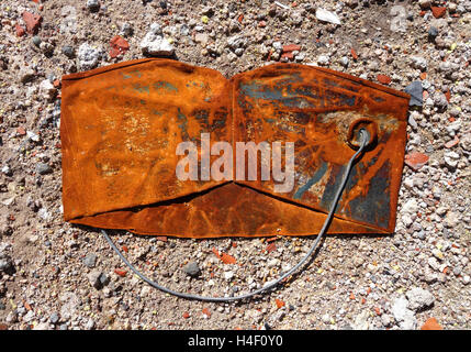 Old crushed rusty bucket on dusty background Stock Photo - Alamy