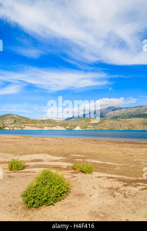 beautiful landscape with plants, sand and the Ionian sea in background ...