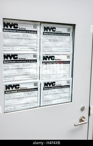 Building permits on construction site wall in New York City, USA Stock ...
