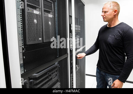 Computer Engineer Opening Server Rack Door In Data Center Stock Photo ...