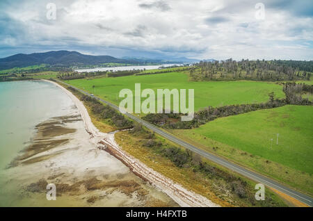Aerial view of Dunnaley Bay and farmland. Dunnaley, Tasmania, Australia ...