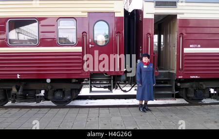 A provodnitsa (train attendant) working on the trans-Siberian express ...