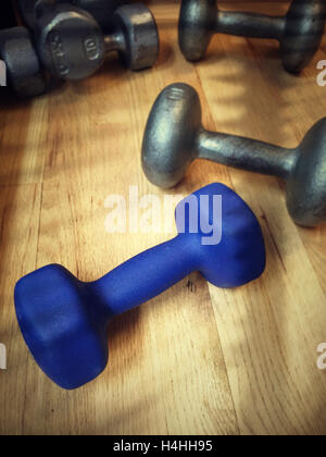 Exercise and fitness metal dumbell weights in gym on rack for weight ...