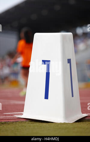 Numbers signpost in an athletic running track. Vertical Stock Photo - Alamy