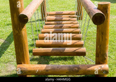 the childrens bridge made of logs and chains Stock Photo - Alamy