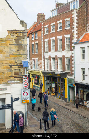 Historic Church Street in Whitby North Yorkshire UK in autumn sun light ...