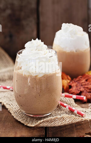 Fresh pumpkin juice with straws Stock Photo - Alamy