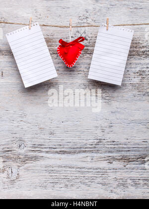 Red paper note hang on hemp rope and have copy space for design in your ...