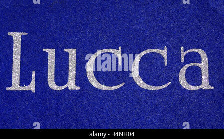 glitter lucca Written of an Italian City on fabric background Stock ...