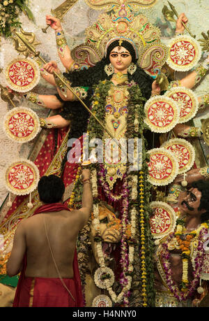 The image of Pandit praying in front of goddess Durga, Mumbai ...