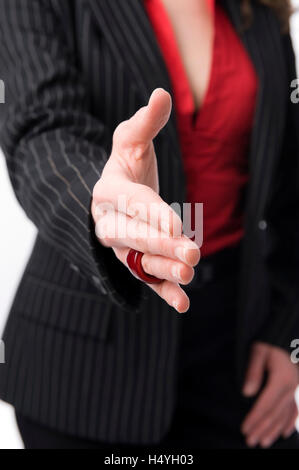 Close up of handshake on blurry conference room interior background ...