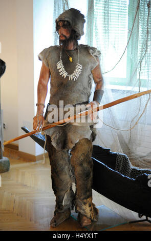 Poland. Prehistory. Neolithic. Recreation of a hunter and his dress ...