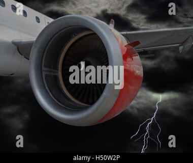 A plane flying through rain clouds is seen from Whittier, Calif ...