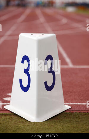 Number three signpost in an athletic running track. Vertical Stock ...