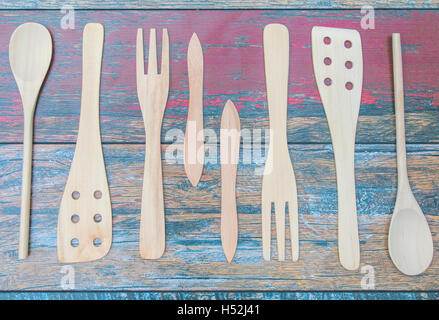 Wooden, decorative kitchen utensils with a broken spoon Stock Photo - Alamy