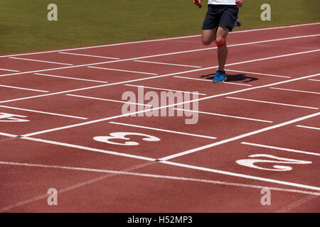 Detail of a male athlete in a running track. Horizontal Stock Photo - Alamy