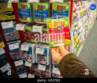 A shopper chooses a Green Dot brand MoneyPak prepaid card in a store in ...
