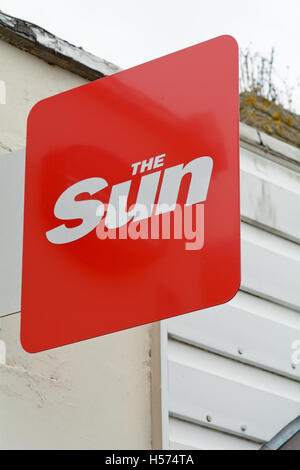 The Sun newspaper shop sign Stock Photo - Alamy