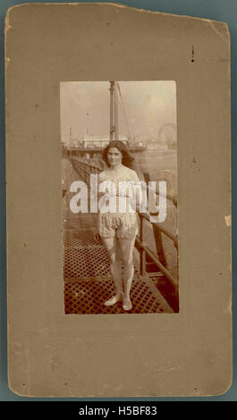 The photograph captures Beatrice Kerr standing on a diving board ...
