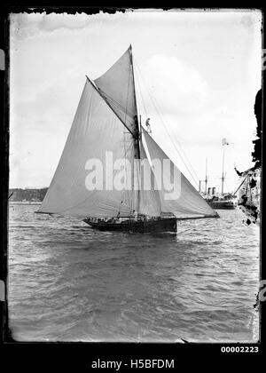 A gaff cutter, a type of sailing boat with a gaff rig, is shown sailing ...